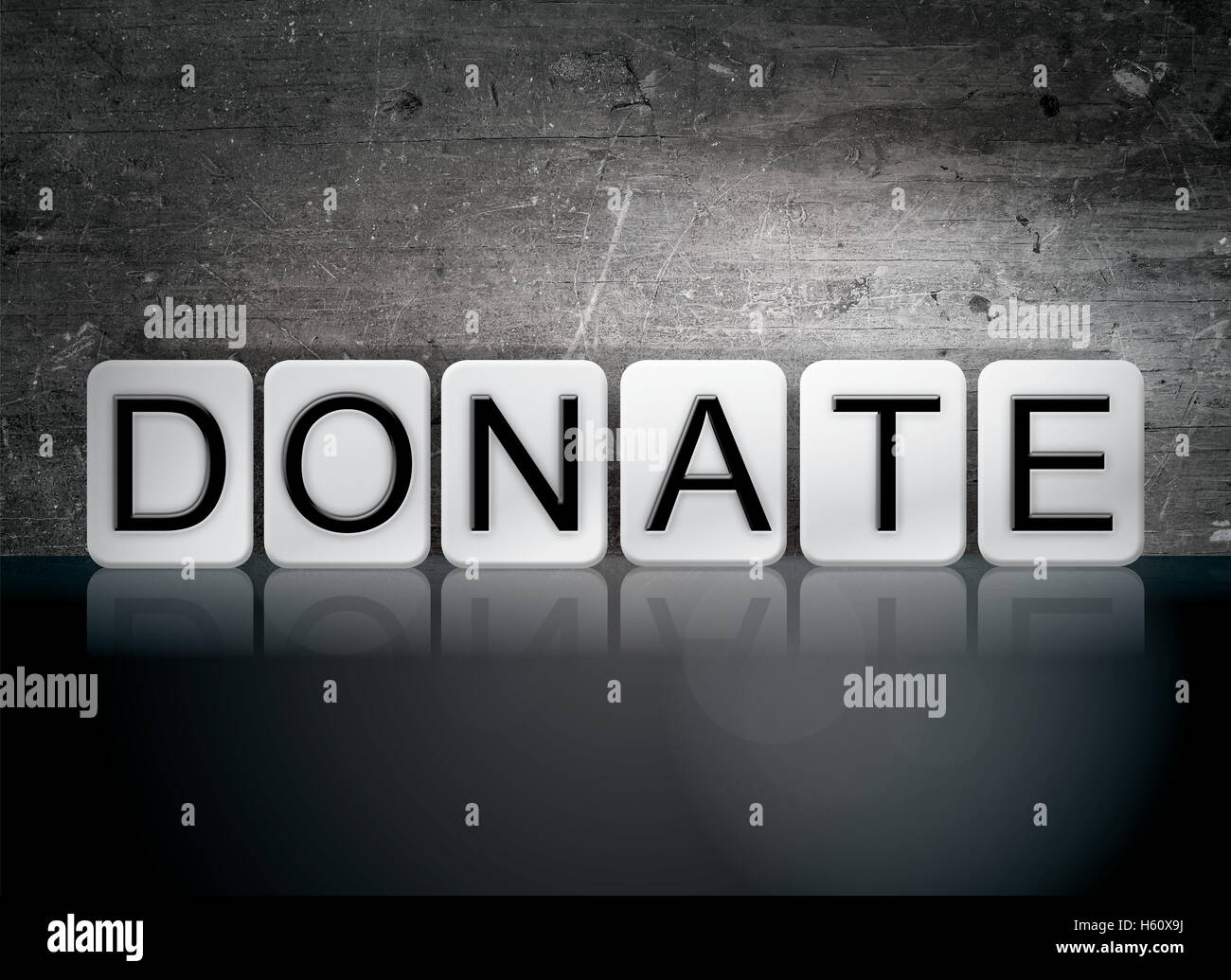 The word "Donate" written in white tiles against a dark vintage grunge ...