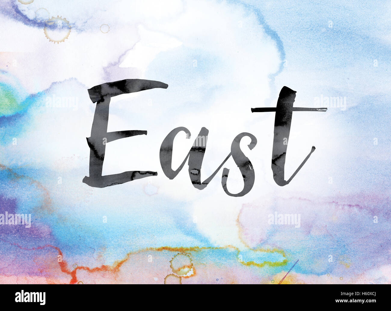 The word "East" painted in black ink over a colorful watercolor washed ...