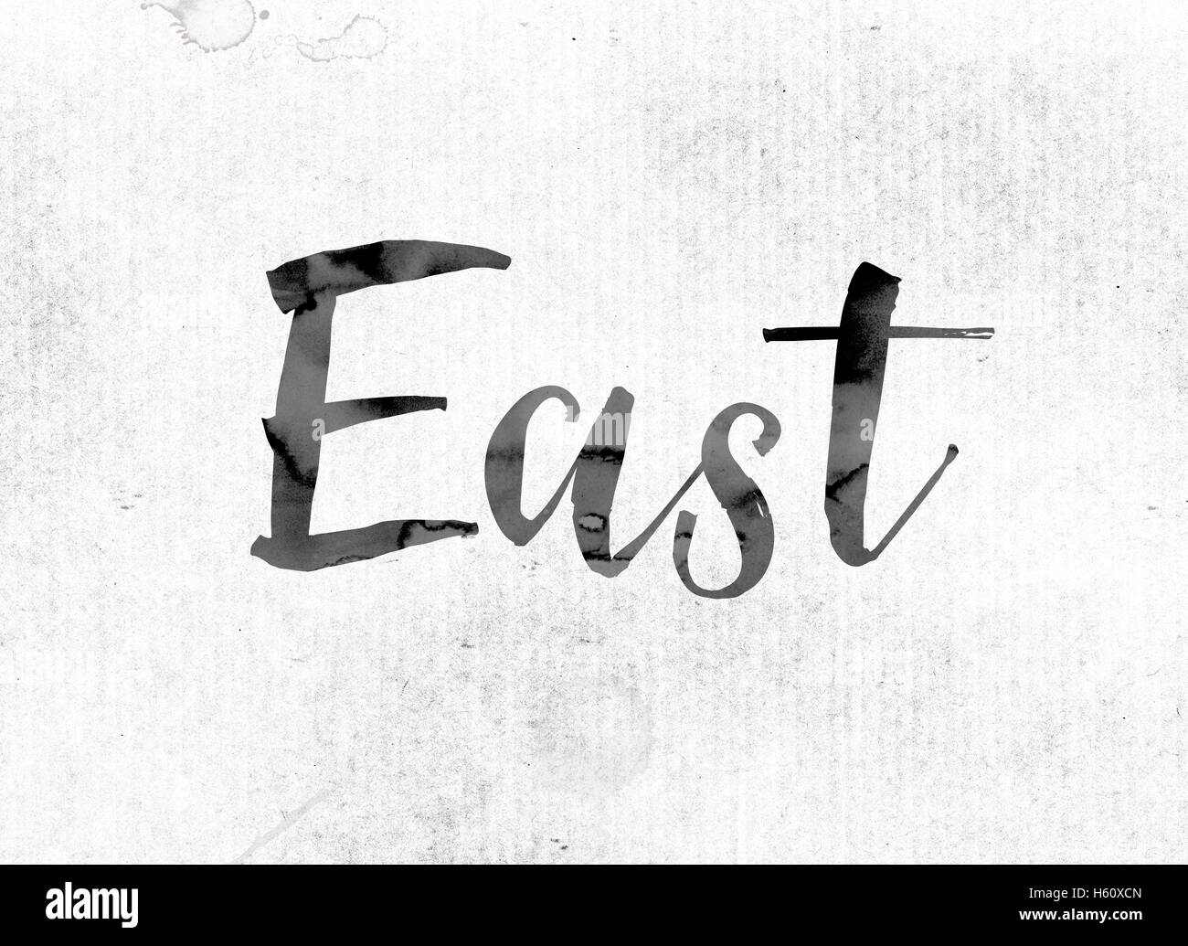 The word "East" concept and theme painted in watercolor ink on a white ...