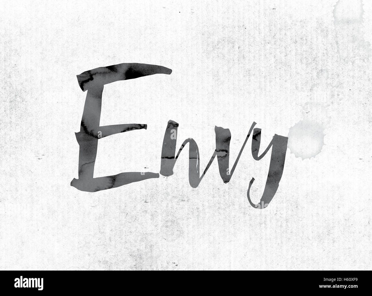The word "Envy" concept and theme painted in watercolor ink on a white ...