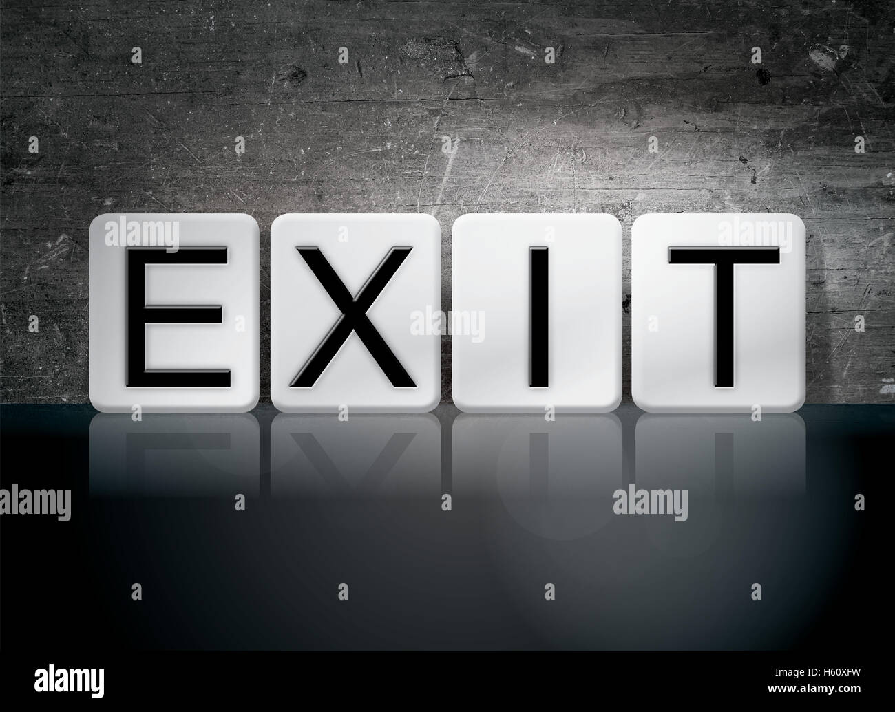 The word "Exit" written in white tiles against a dark vintage grunge ...