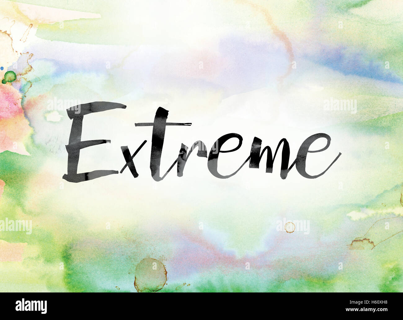The word "Extreme" painted in black ink over a colorful watercolor ...