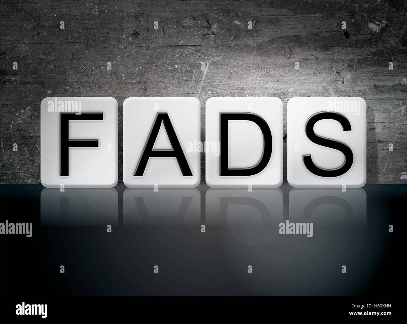 The word "Fads" written in white tiles against a dark vintage grunge ...