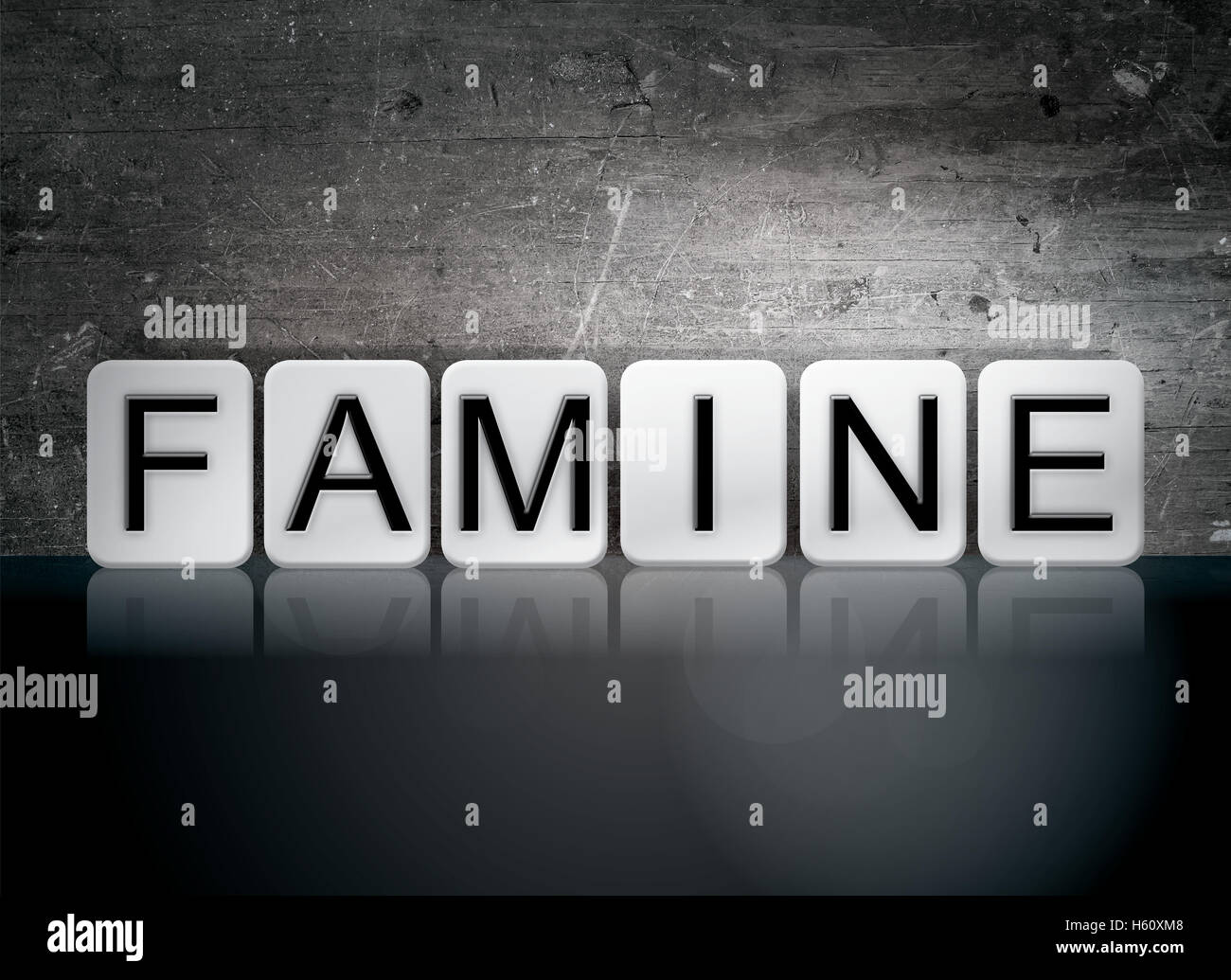The word "Famine" written in white tiles against a dark vintage grunge ...
