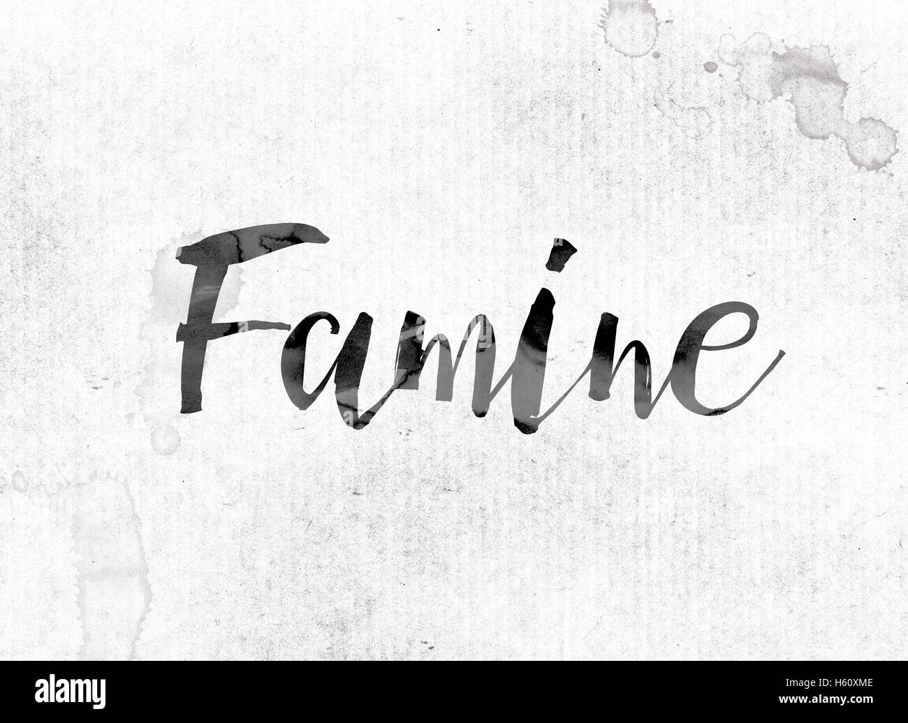 The word "Famine" concept and theme painted in watercolor ink on a ...