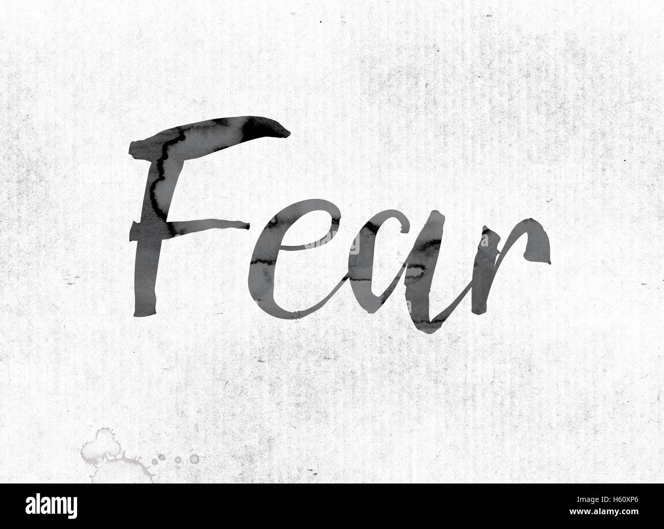 The word "Fear" concept and theme painted in watercolor ink on a white ...