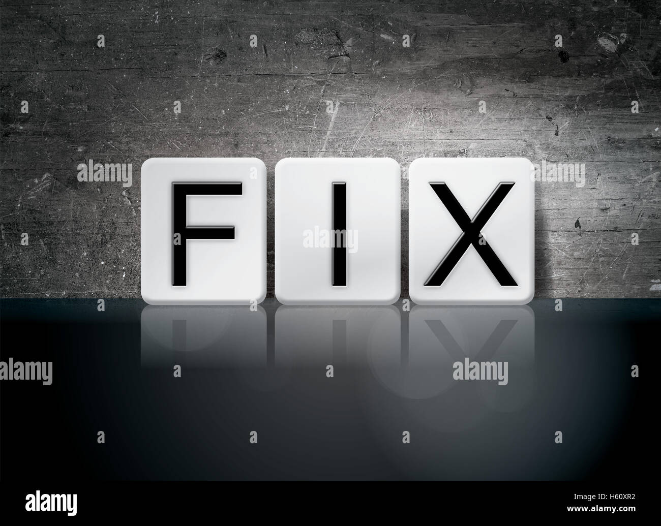 The word "Fix" written in white tiles against a dark vintage grunge ...