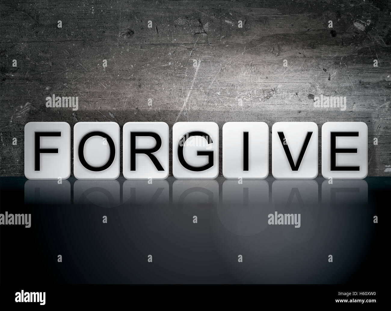 The word "Forgive" written in white tiles against a dark vintage grunge ...