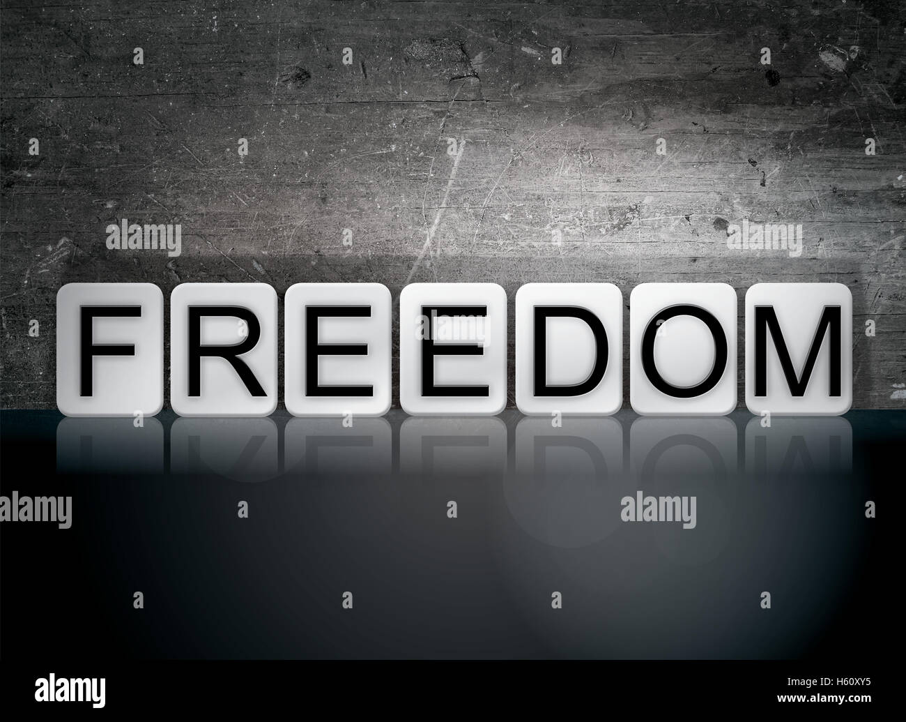 The word "Freedom" written in white tiles against a dark vintage grunge ...