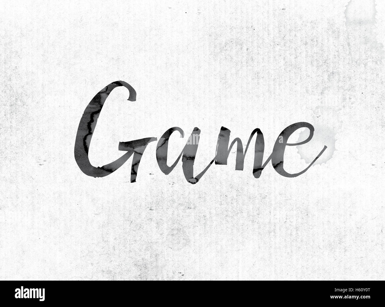 The word "Game" concept and theme painted in watercolor ink on a white ...