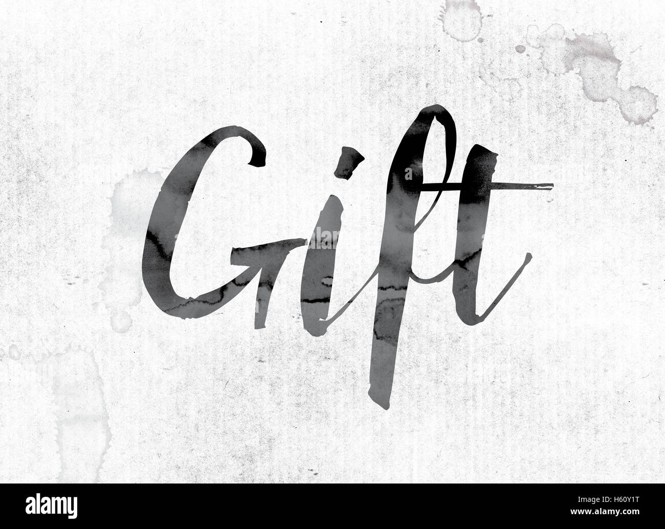 The word "Gift" concept and theme painted in watercolor ink on a white ...