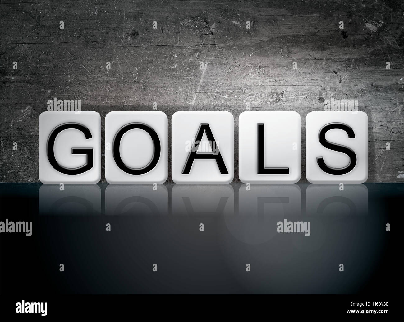 The word "Goals" written in white tiles against a dark vintage grunge ...