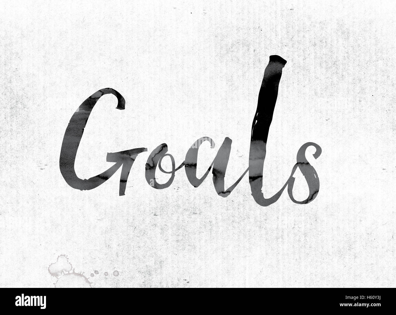 The word "Goals" concept and theme painted in watercolor ink on a white ...