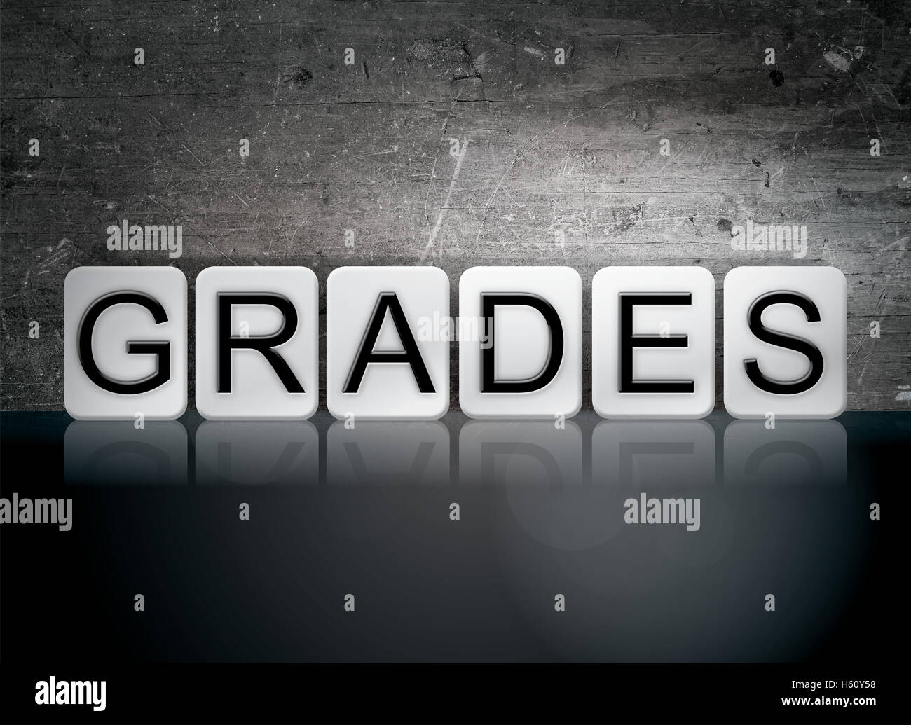 The word "Grades" written in white tiles against a dark vintage grunge ...