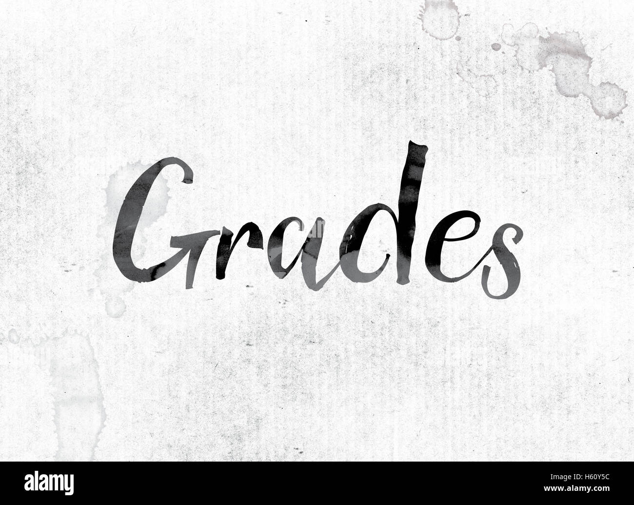 The word "Grades" concept and theme painted in watercolor ink on a ...