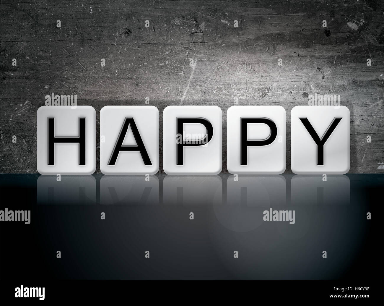 The word "Happy" written in white tiles against a dark vintage grunge ...