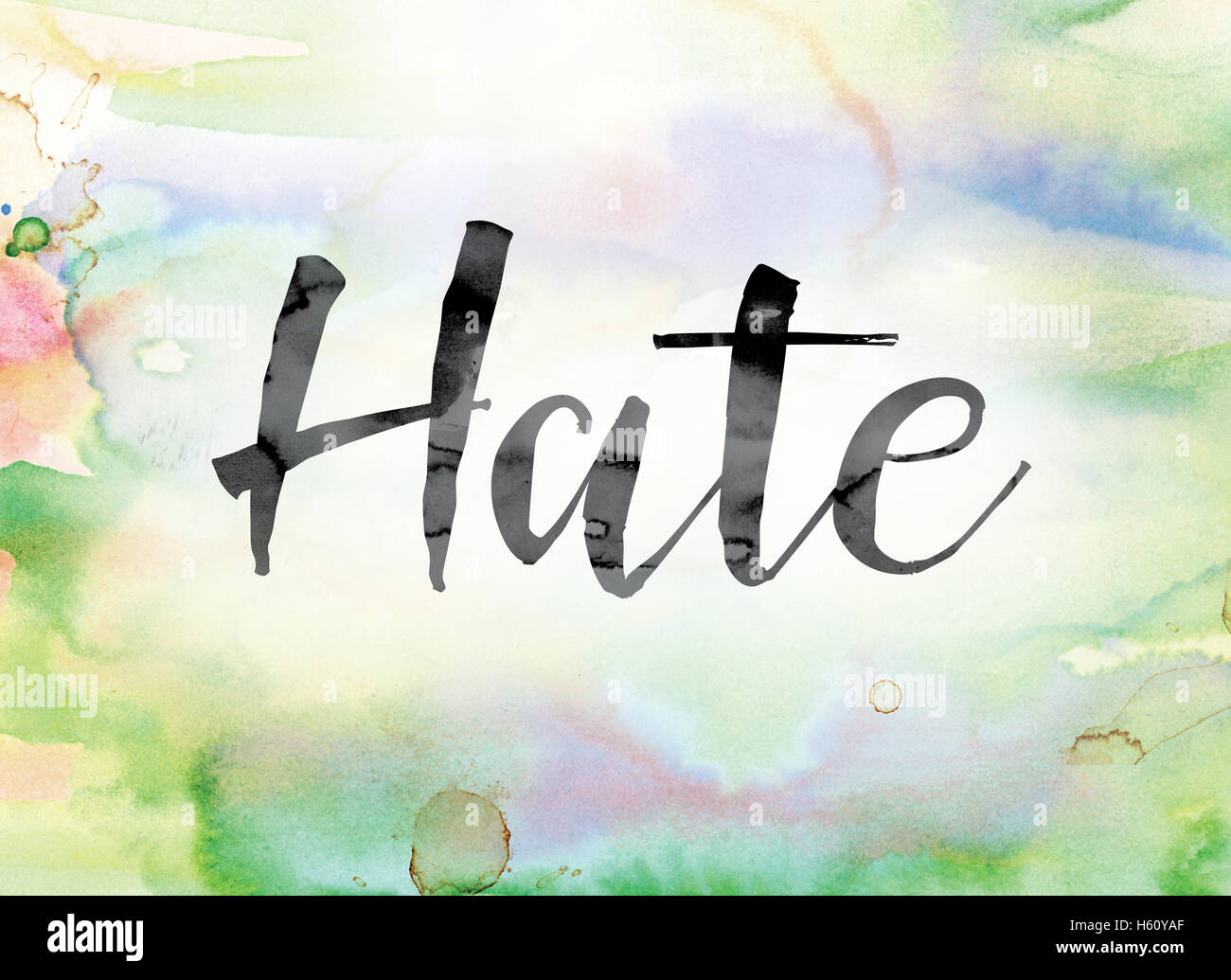 The word "Hate" painted in black ink over a colorful watercolor washed ...