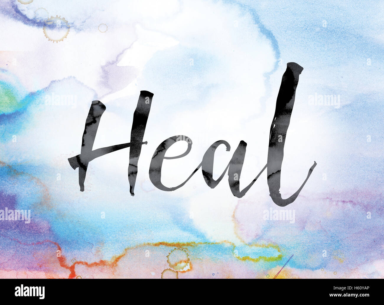 The word "Heal" painted in black ink over a colorful watercolor washed ...