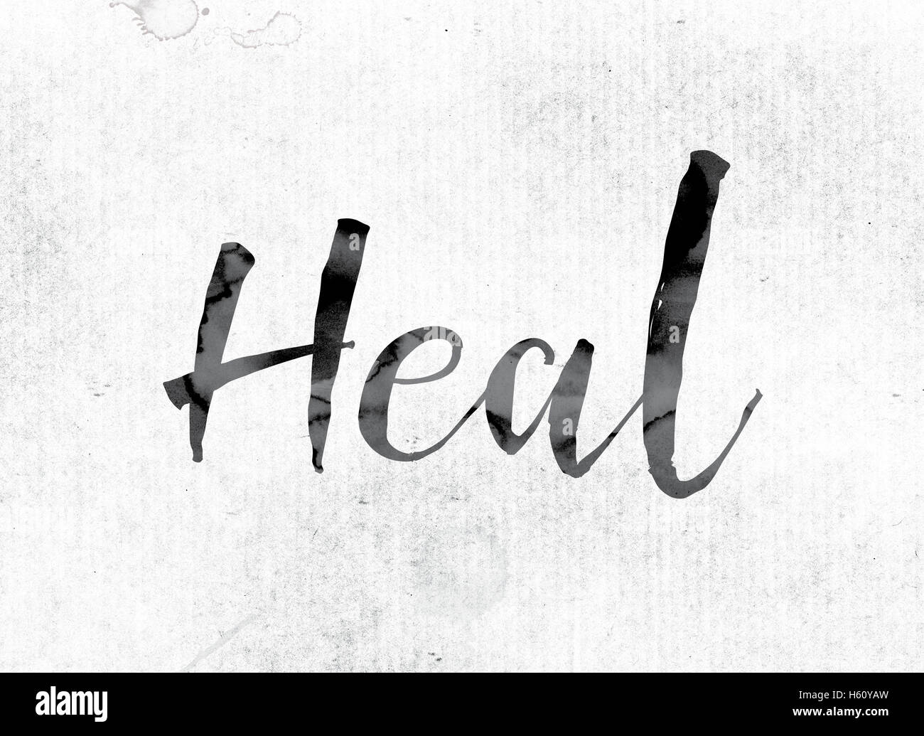 The word "Heal" concept and theme painted in watercolor ink on a white ...
