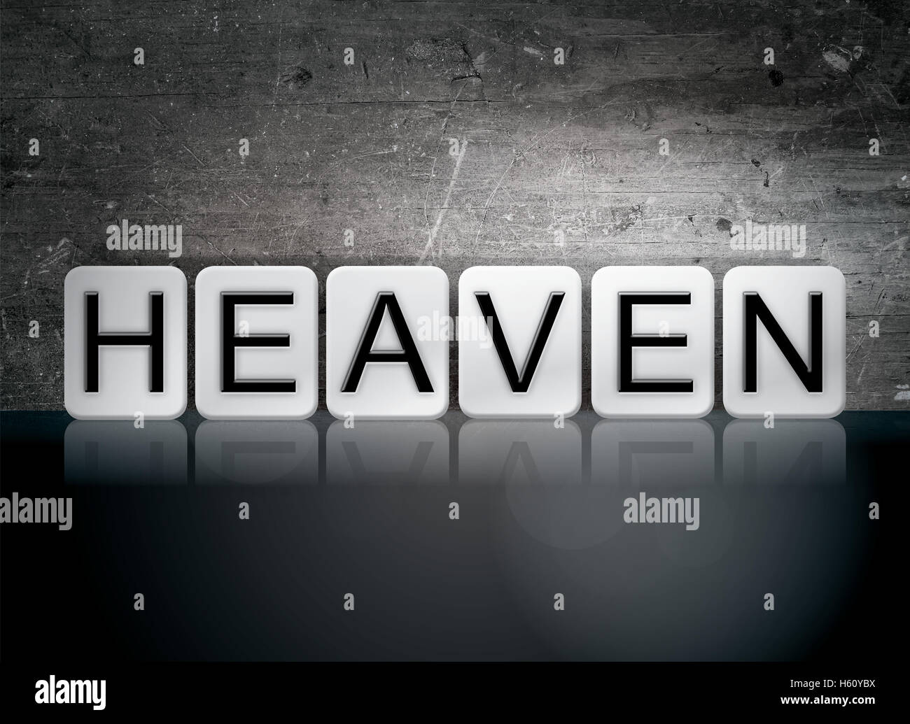 The word "Heaven" written in white tiles against a dark vintage grunge ...