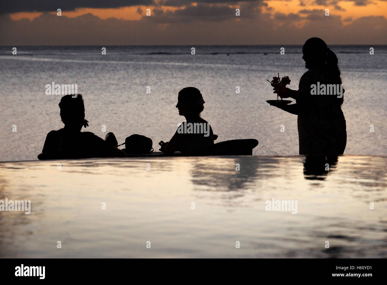 Aitutaki. Cook Island. Polynesia. South Pacific Ocean. A waitress ...