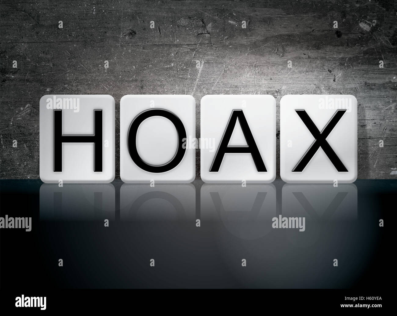 The word "Hoax" written in white tiles against a dark vintage grunge ...