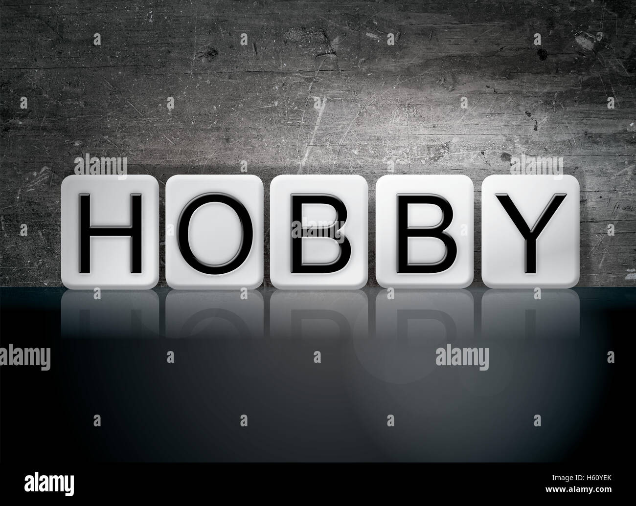 The word "Hobby" written in white tiles against a dark vintage grunge ...