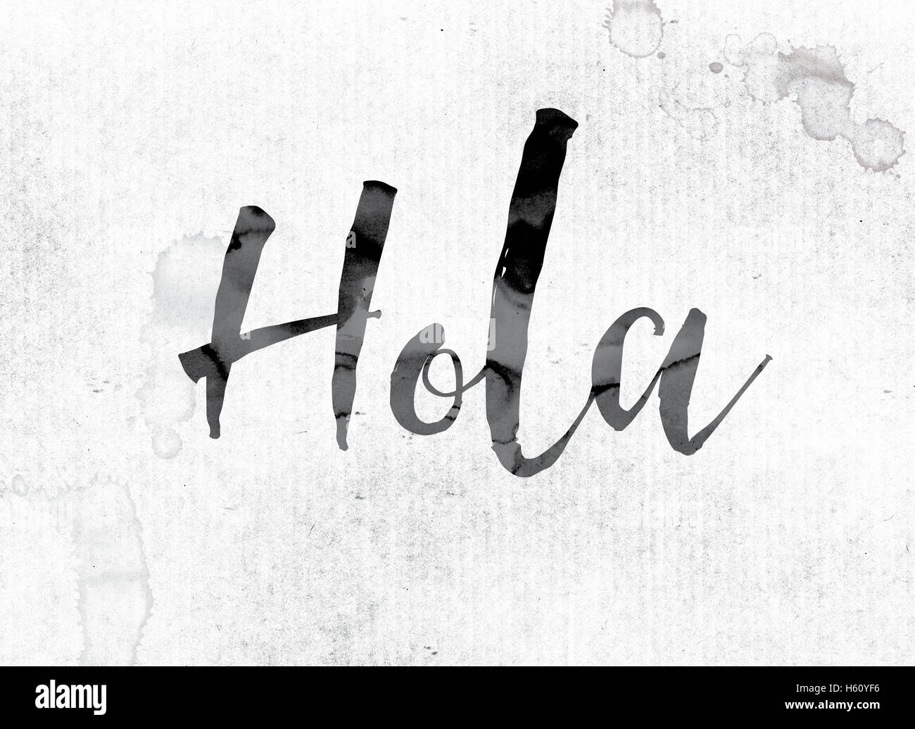 The word "Hola" concept and theme painted in watercolor ink on a white ...