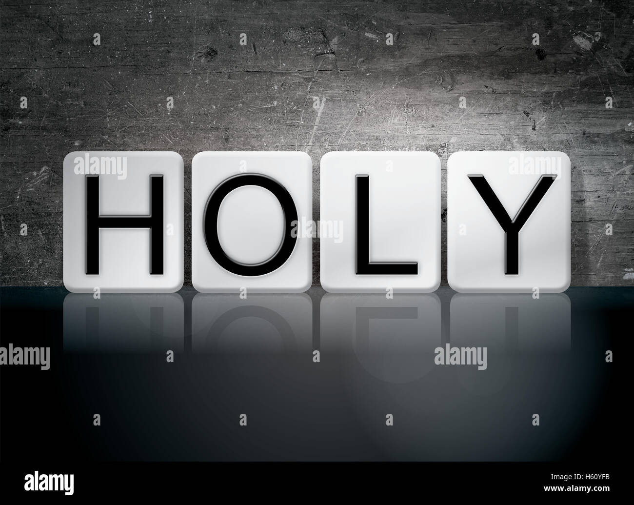The word "Holy" written in white tiles against a dark vintage grunge ...