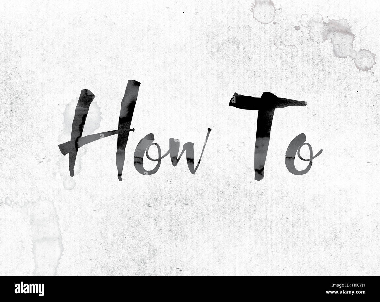 The word "How To" concept and theme painted in watercolor ink on a ...
