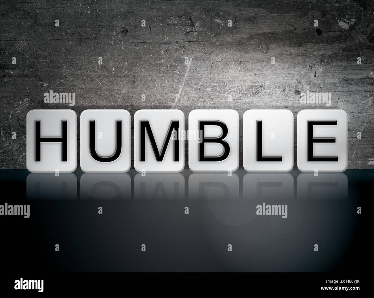 The word "Humble" written in white tiles against a dark vintage grunge ...