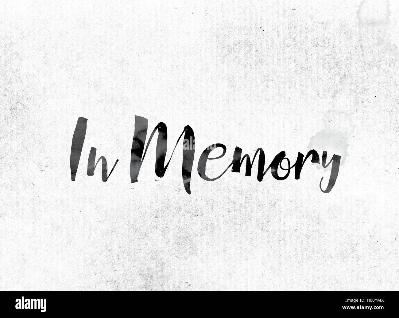 The word "In Memory" concept and theme painted in watercolor ink on a ...