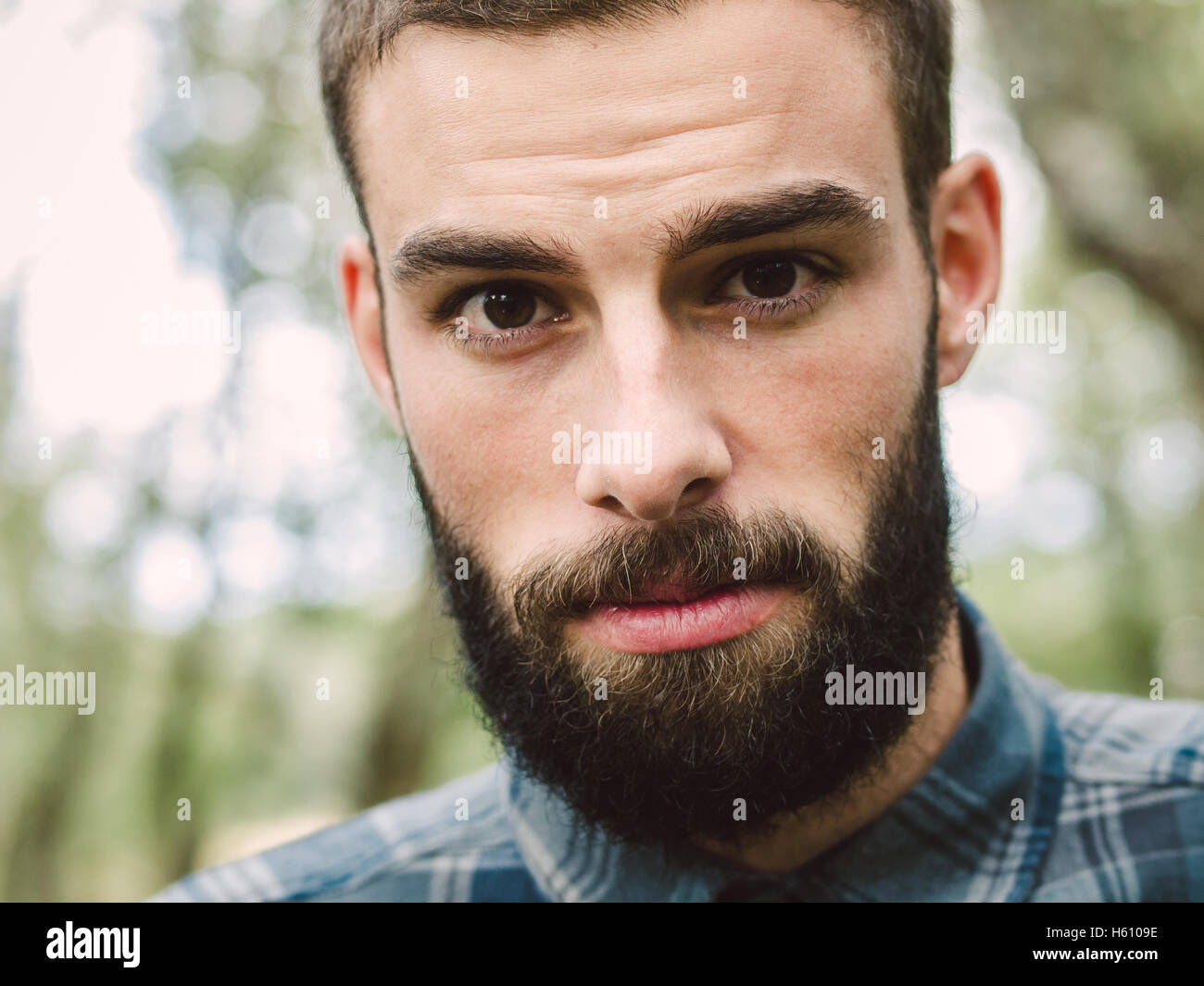 Hipster man portrait in horizontal composition outdoors Stock Photo - Alamy