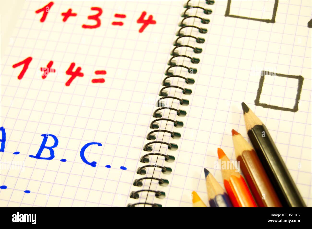 Five coloured pencils put on an exercise book Stock Photo - Alamy
