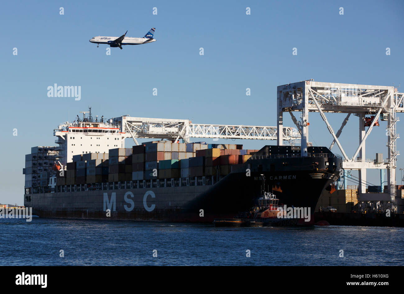 A jet approaches Logan Airport over the container terminal in South ...