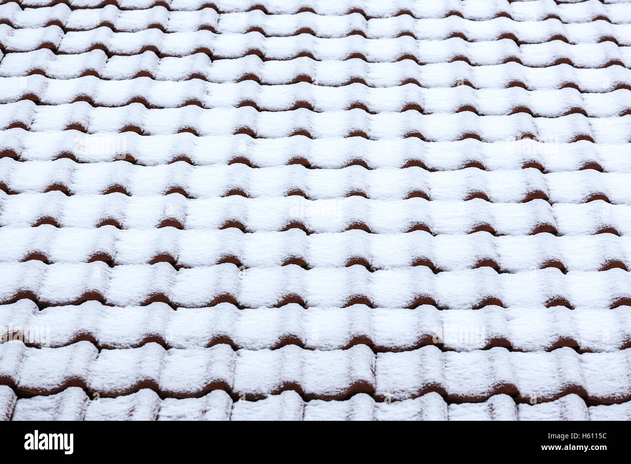 tiled ceramic roof under snow background texture Stock Photo - Alamy