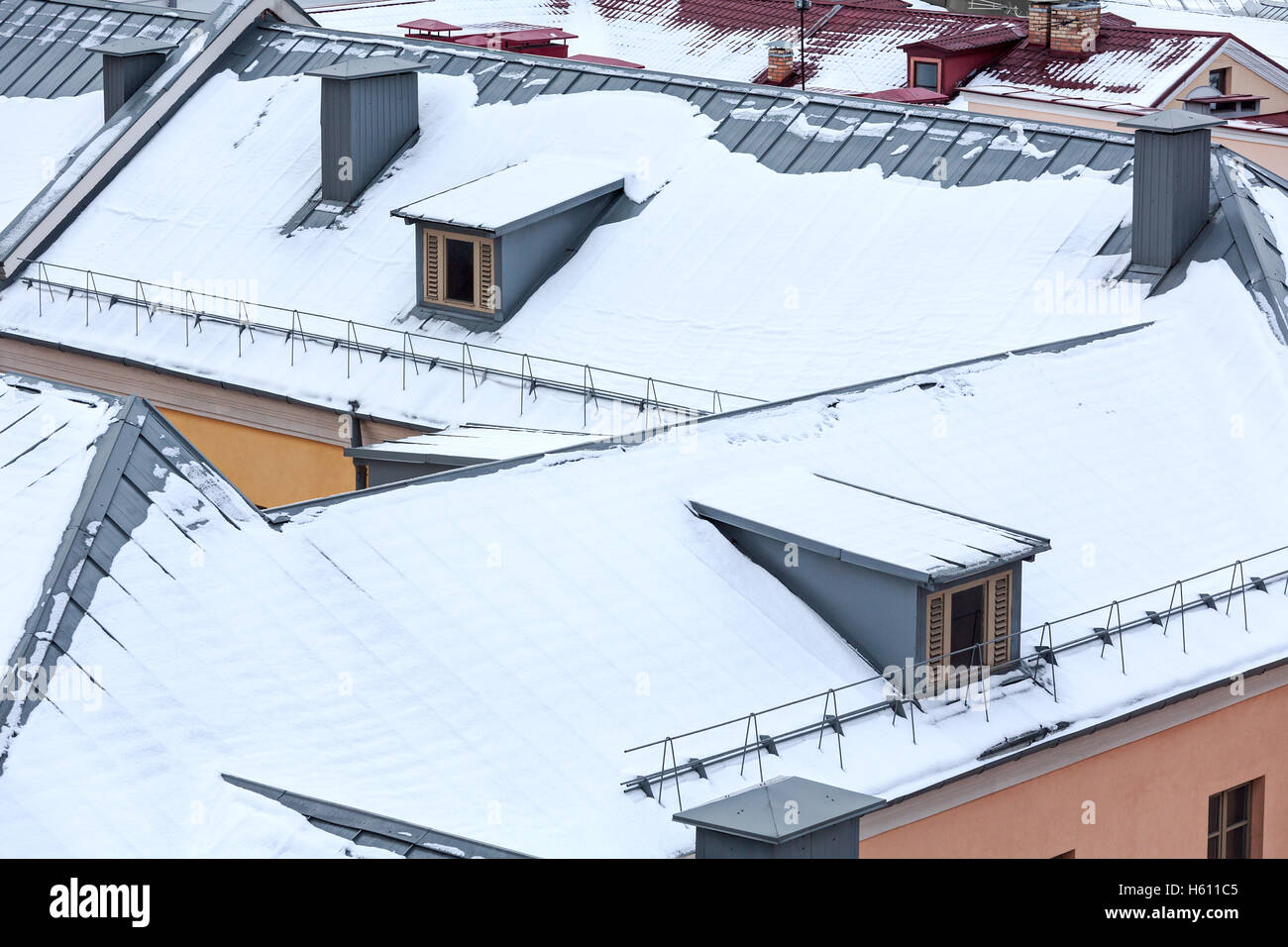 snow covered roofs of residential houses with gable dormers Stock Photo ...