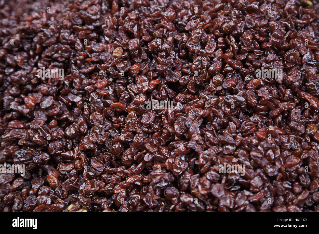 Red dried raisins, dried fruit red detail, traditional Spanish food ...