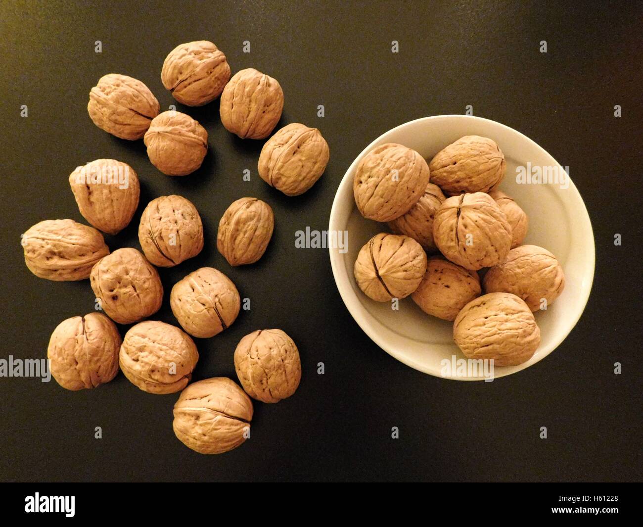 Nuts with shell on wooden background Stock Photo - Alamy