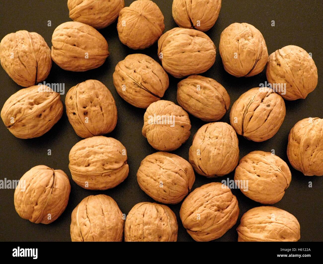 Nuts with shell on wooden background Stock Photo - Alamy
