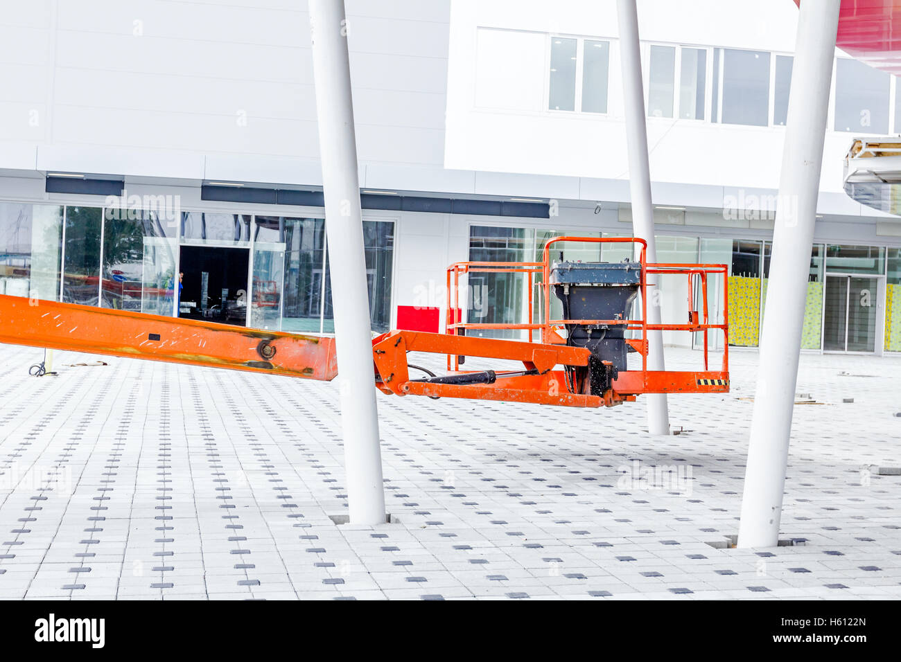 High elevated cherry picker people are working at new assembled ...