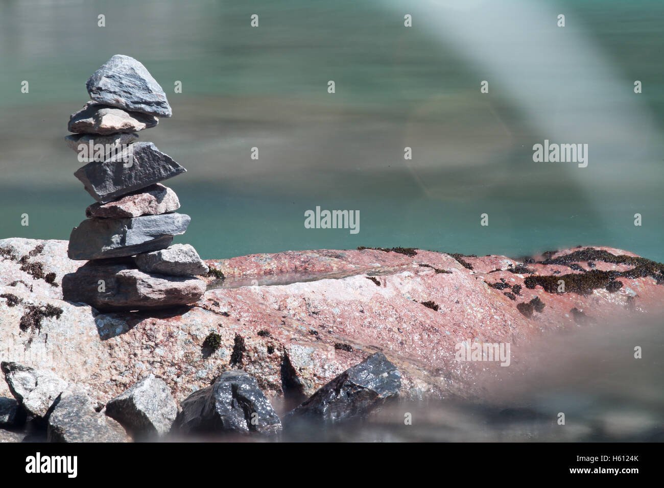 Rock stack on stone in pure river in Norway, long exposure Stock Photo ...