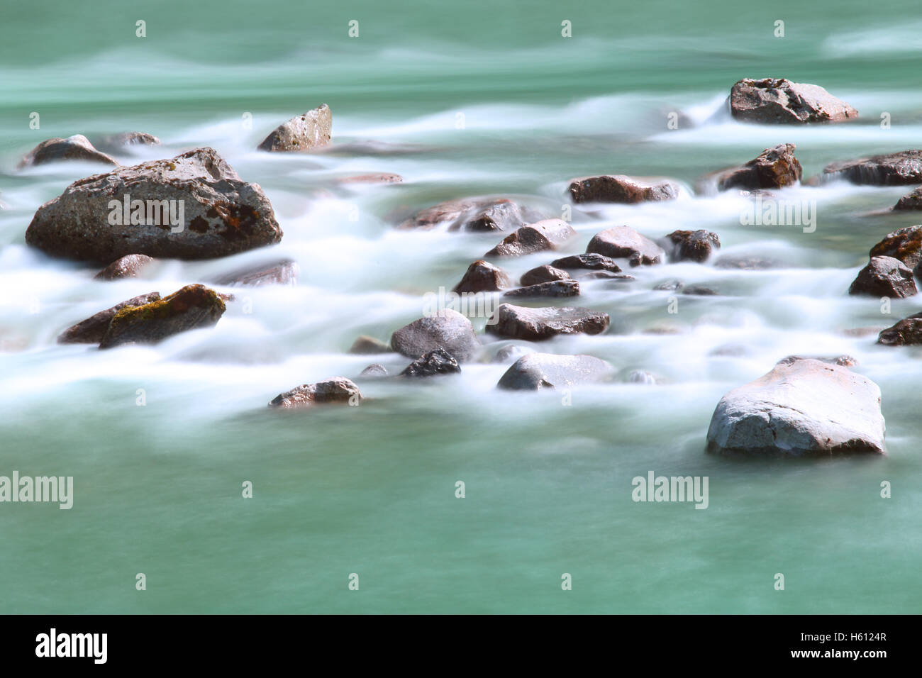Fast flowing water in river rapids, long exposure Stock Photo - Alamy