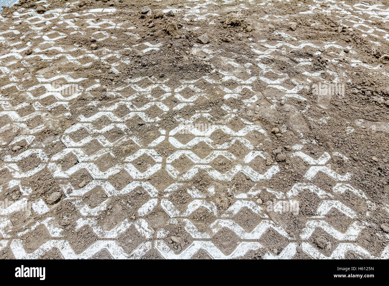 Leveling and filling out symmetrical and decorative precast cobblestone ...