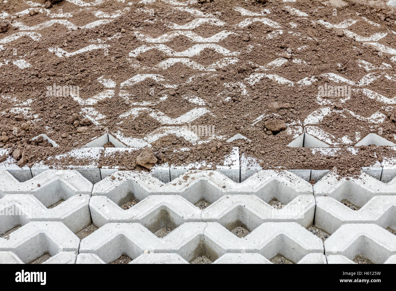 Leveling and filling out symmetrical and decorative precast cobblestone ...