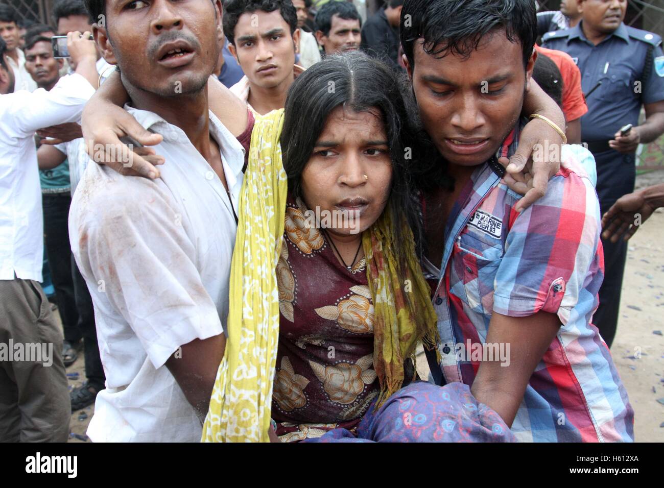 People rescue garment worker who was trapped under the rubble of the ...