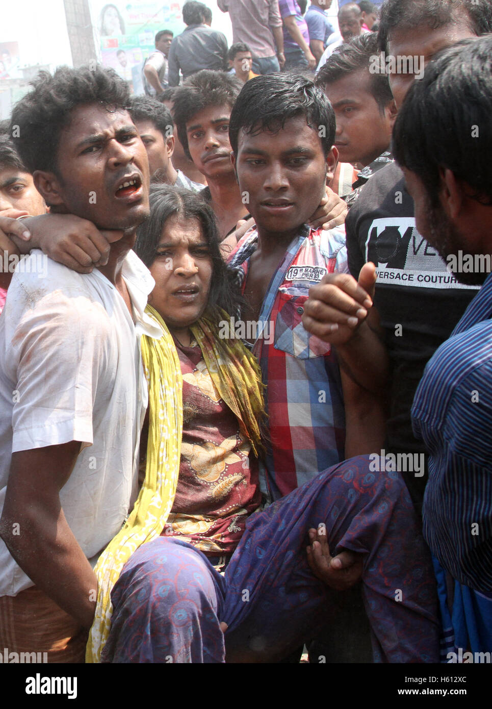 People rescue garment worker who was trapped under the rubble of the ...
