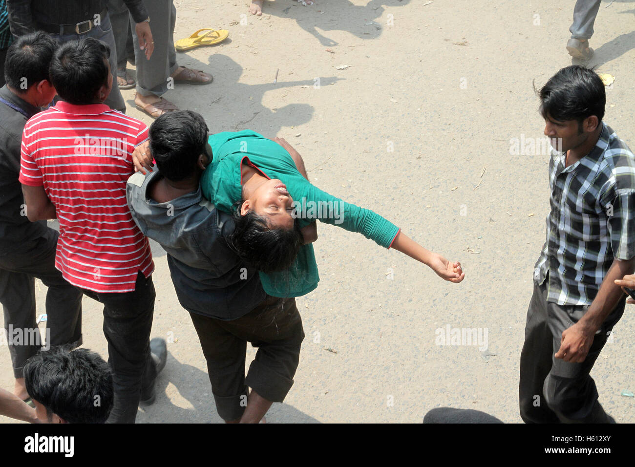 People rescue garment worker who was trapped under the rubble of the ...