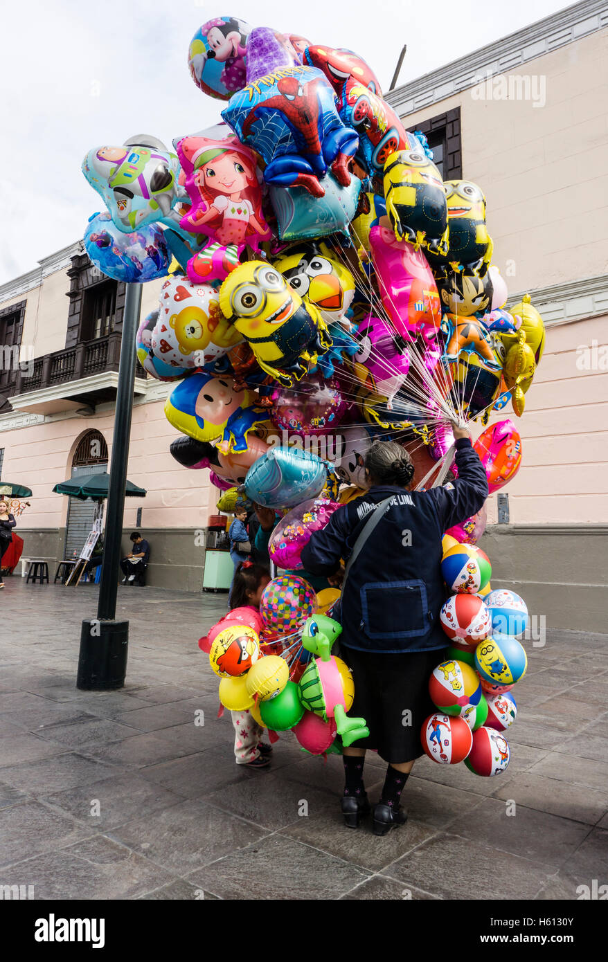 Selling balloons in the historic center of Lima city, Peru Stock Photo ...