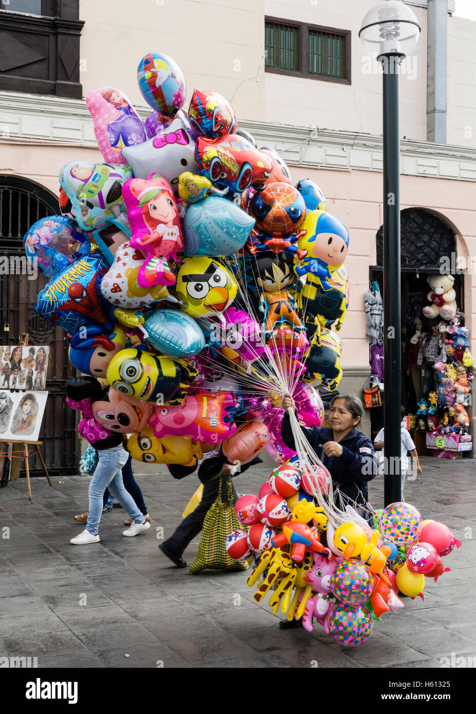 Selling balloons in the historic center of Lima city, Peru Stock Photo ...
